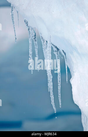 Ice hanging from an edge of an iceberg Stock Photo - Alamy