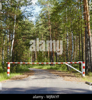 Barrier, blocking the road into the woods Stock Photo - Alamy