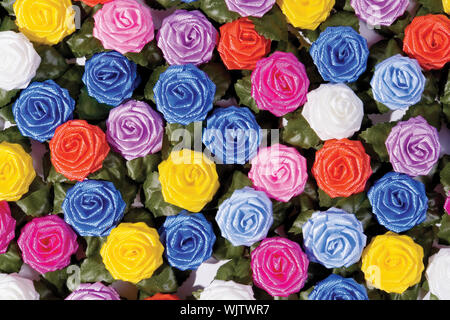 many-coloured plastics roses on a white background in shape heart Stock ...