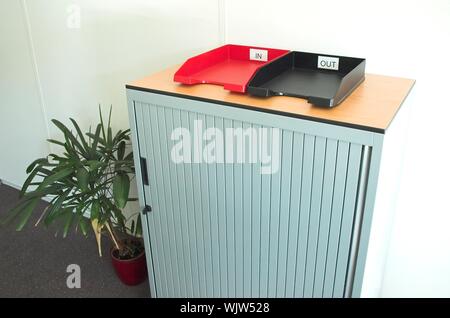 Inbox and outbox trays in an office over white background Stock Photo ...