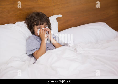 Cute little boy suffering from diarrhea, sitting on toilet. Child ...