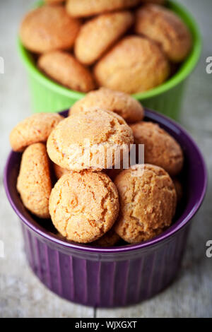 meringue almond cookies in bowls on wooden background Stock Photo - Alamy