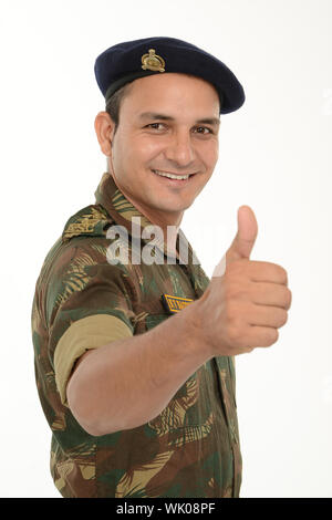 Army soldier showing thumbs up sign with credit card Stock Photo - Alamy