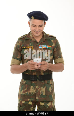 Army soldier text messaging on a mobile phone Stock Photo - Alamy