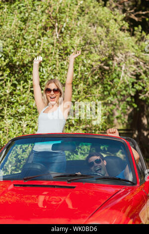 young loving couple in the convertible on the way Stock Photo - Alamy