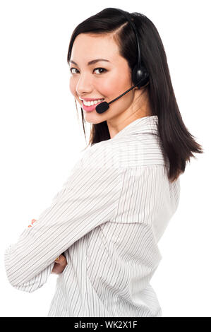 Cheerful female telecaller wearing headset and posing confidently with ...