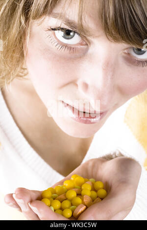 Young woman doctor with colorful pills Stock Photo - Alamy
