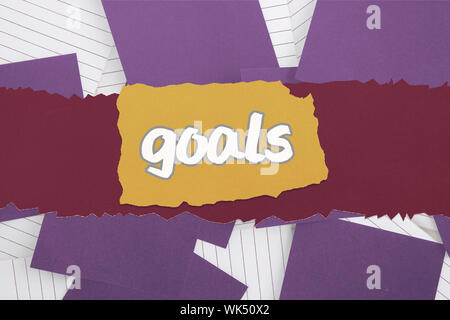 Goals against purple paper strewn over notepad Stock Photo - Alamy