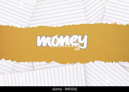 Money against lined paper strewn over surface Stock Photo - Alamy