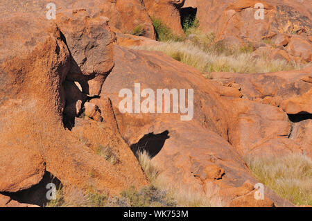 Sandstone boulders in Namibia at sunrise. The shadow resembles a ...