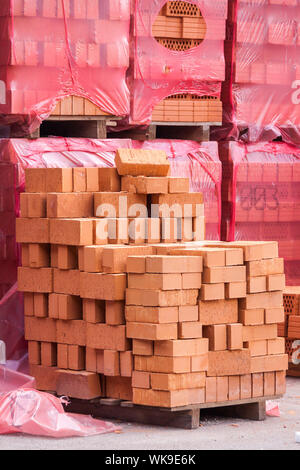 Bricks on pallets. Storage of bricks at the construction site Stock ...