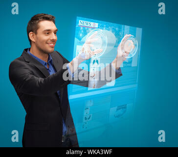 Pressing buttons. A handsome young businessman pointing at copyspace ...