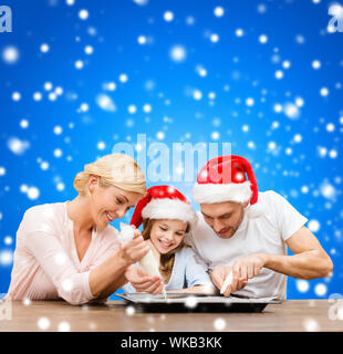 happy family in santa helper hats with gift boxes Stock Photo - Alamy