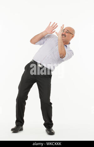 Businessman defending himself Stock Photo - Alamy