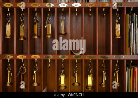 old hotel room key with number isolated on white Stock Photo - Alamy