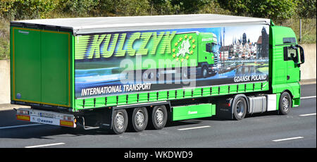 Polish articulated trailer and hgv juggernaut lorry truck driving along ...