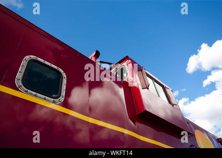 Detail of a shiny red train caboose Stock Photo - Alamy