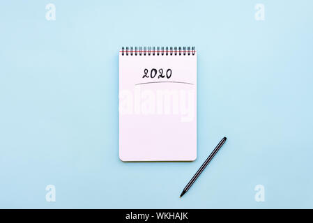 Empty to do list for new year. Notebook on pink table, planning concept ...