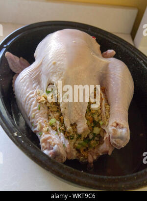 Raw meat with cooked stuffing for baking Stock Photo - Alamy