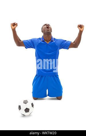 Excited young football player cheering on white background Stock Photo ...