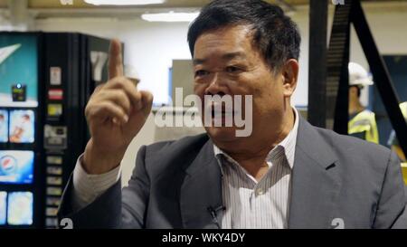 AMERICAN FACTORY, Chairman Cao Dewang (center) cutting ribbon at ...