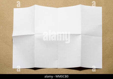 A piece of paper, crumpled paper, an unfolded sheet of paper on a white ...