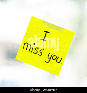 I miss you word sticky note on window mirror Stock Photo - Alamy