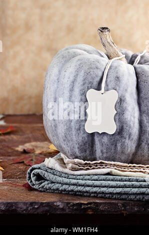 Blank photo frame with Halloween pumpkins, bats and lantern on table ...