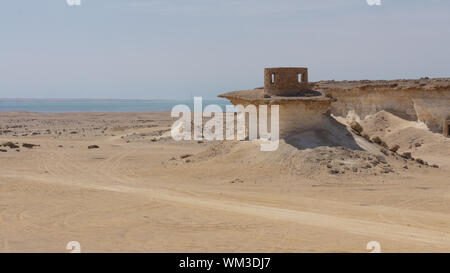 Rocks and a fortress in the desert in Doha, Qatar Stock Photo - Alamy