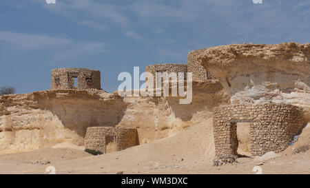 Rocks and a fortress in the desert in Doha, Qatar Stock Photo - Alamy
