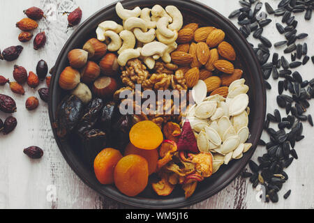 Dates and dried fruits, nuts and seeds. Copy space Stock Photo - Alamy