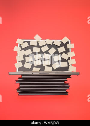 Grey laptop overflowed with empty post-its isolated Stock Photo - Alamy