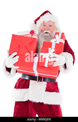 Santa carries a few presents close on white background Stock Photo - Alamy