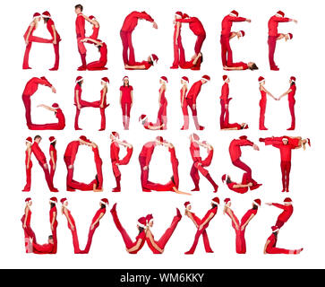 Group of red dressed people forming the phrase 'Merry Christmas ...