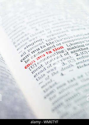 the word 'commutation' highlighted in a dictionary Stock Photo - Alamy