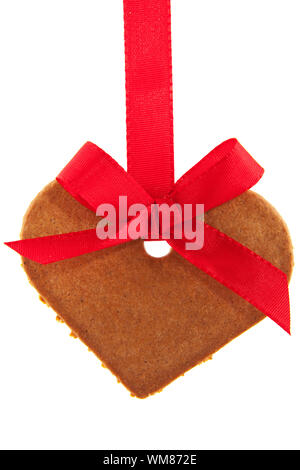 Gingerbread heart with red ribbon hanging as a garland Stock Photo - Alamy