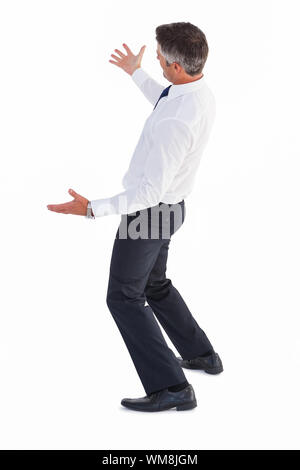Happy businessman without jacket with arms out on white background ...