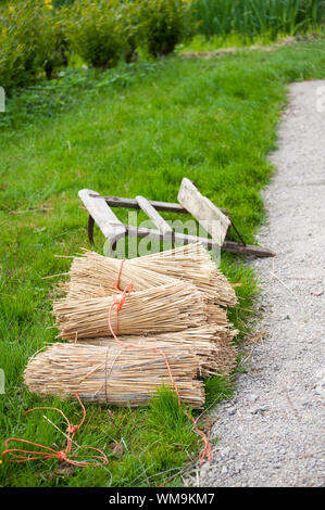 Tools for making a straw roof in Holland Stock Photo - Alamy