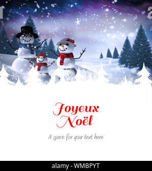 Joyeux noel against snowman family Stock Photo - Alamy