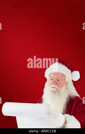 Santa claus checking his list against red background Stock Photo - Alamy