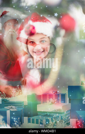 Santa writing his list against blue Stock Photo - Alamy