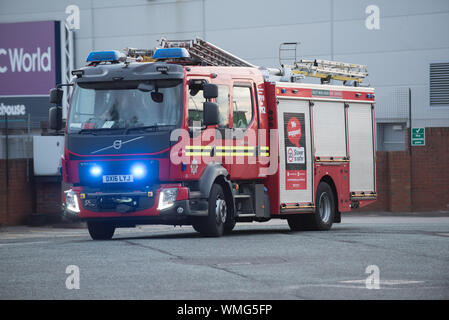 A Moving Fire Engine with Blue Lights On Stock Photo - Alamy