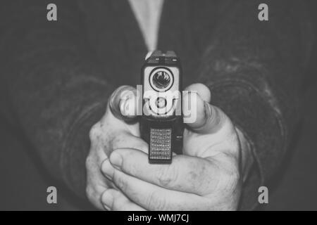 man pointing gun Stock Photo - Alamy