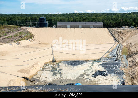 New waste disposal cell being built at landfill with big hole excavated ...