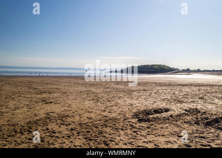 Coast with beach and monuments, Wales Stock Photo - Alamy