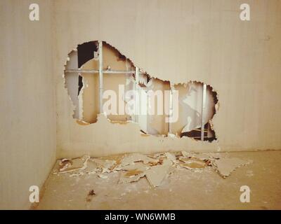 Wall damaged and broken. Building in ruins. Facade dilapidated Stock ...