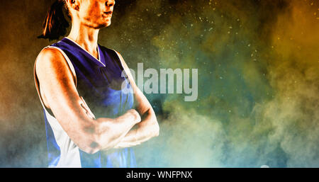 Composite image of tough female basketball player Stock Photo - Alamy