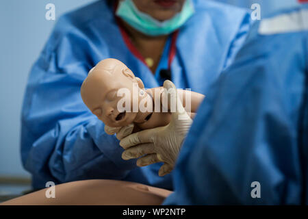 Details with plastic dummies representing a woman and her newly born ...
