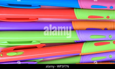many Ball Pen on Pink Background Stock Photo - Alamy