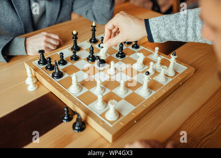 Male chess players, white knight takes pawn Stock Photo - Alamy